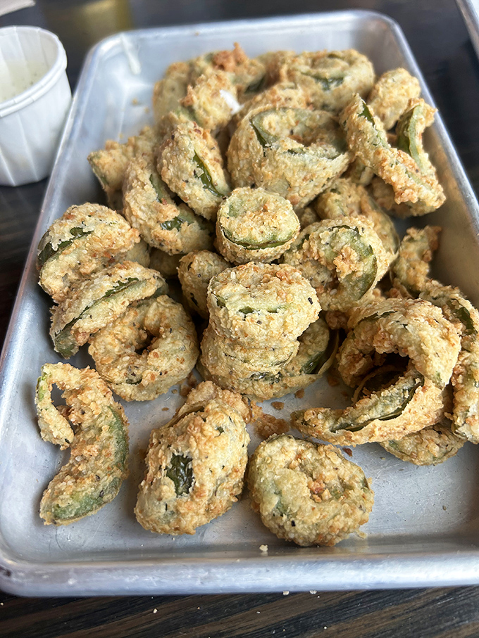 These aren't just fried pickles; they're crispy golden halos of tangy perfection that'll make you question all other appetizers.
