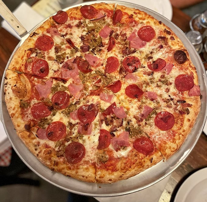 The Three Meats pizza doesn't just satisfy hunger&mdash;it negotiates a peace treaty between pepperoni, ham, and sausage.