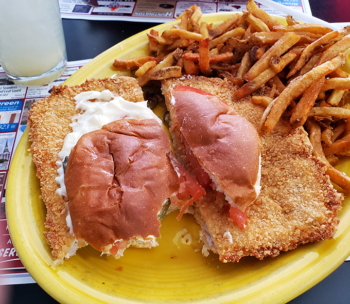 The legendary pork tenderloin sandwich in all its golden-fried glory&mdash;where the meat extends well beyond the bun's jurisdiction, creating what can only be described as a delicious solar eclipse.