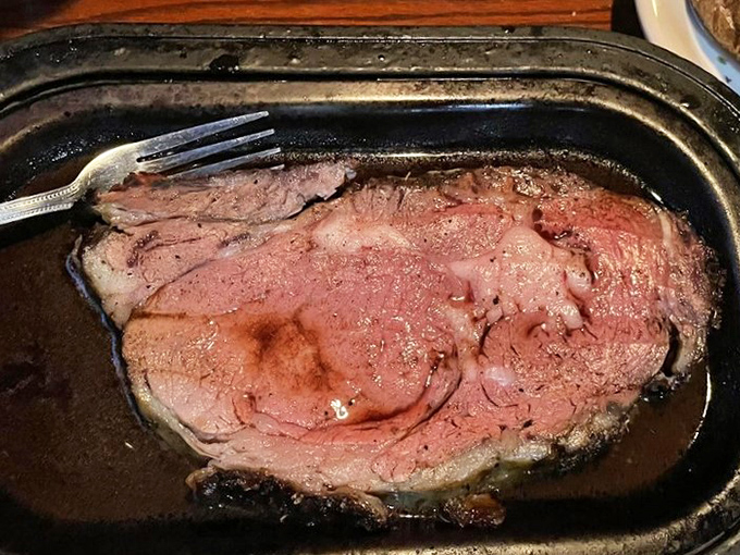 Behold the star of the show—prime rib so perfectly cooked it makes you wonder if you've been eating beef wrong your entire life.