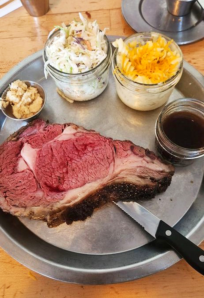 Behold the prime rib in all its rosy, smoke-ringed glory. That perfect pink center speaks of patience, skill, and barbecue wisdom passed down through generations.