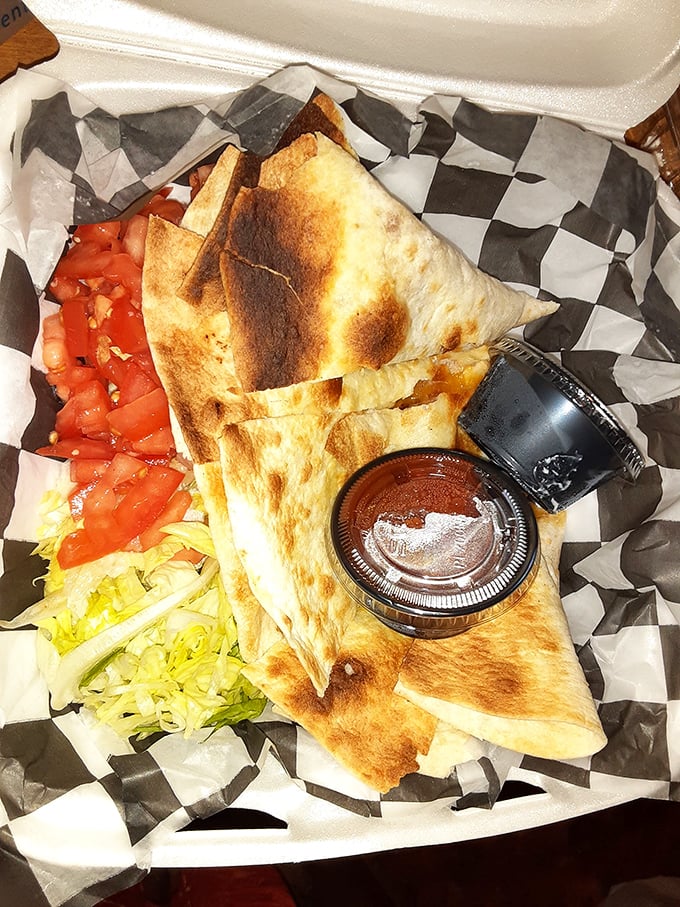The legendary quesadilla arrives like edible origami &ndash; perfectly folded, beautifully browned, with cheese stretching like it's auditioning for a commercial.