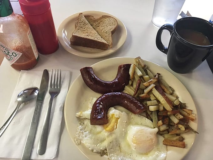 Reindeer sausage: where breakfast meets Alaska's wild spirit. Those perfectly cooked eggs and crispy potatoes aren't just a meal&mdash;they're fuel for Arctic adventures.