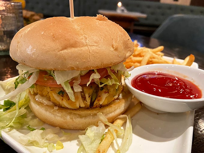 The legendary crab cake sandwich arrives with fries and ketchup, proving that sometimes simplicity is the ultimate sophistication.
