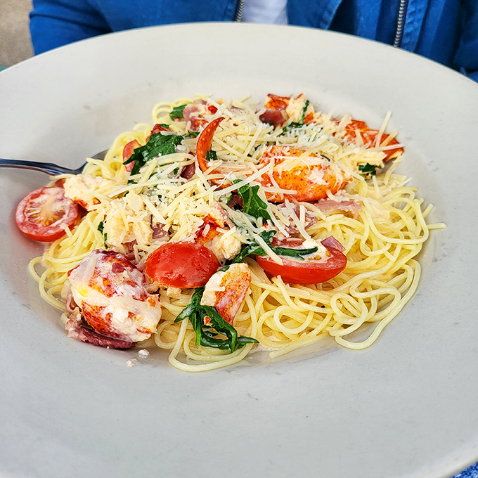 This pasta isn't just a meal, it's a Mediterranean vacation – lobster, cherry tomatoes, and fresh herbs dancing together on perfectly cooked linguine.