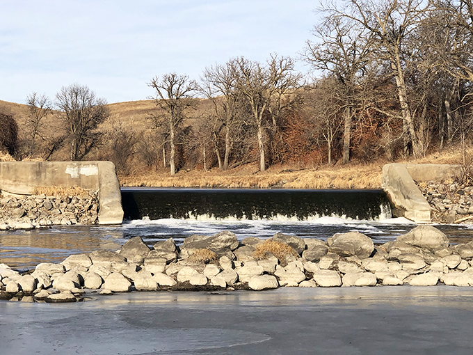 The Sheyenne River creates nature's perfect mirror, reflecting both sky and history as it winds through Valley City's peaceful landscape.