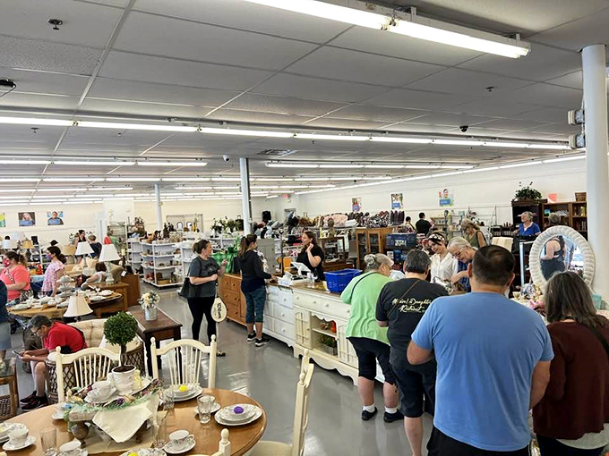 Treasure hunters gather at the checkout, their carts filled with stories waiting to be continued in new homes.