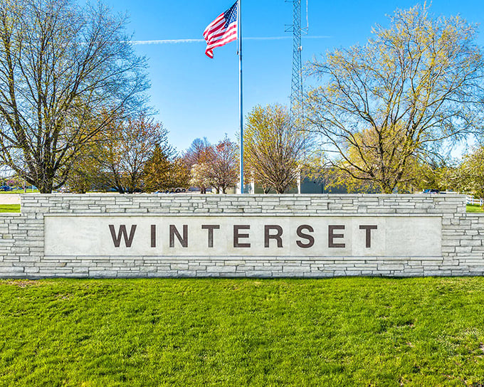 The town's welcoming sign stands proud like a friendly handshake extended to every passing traveler.