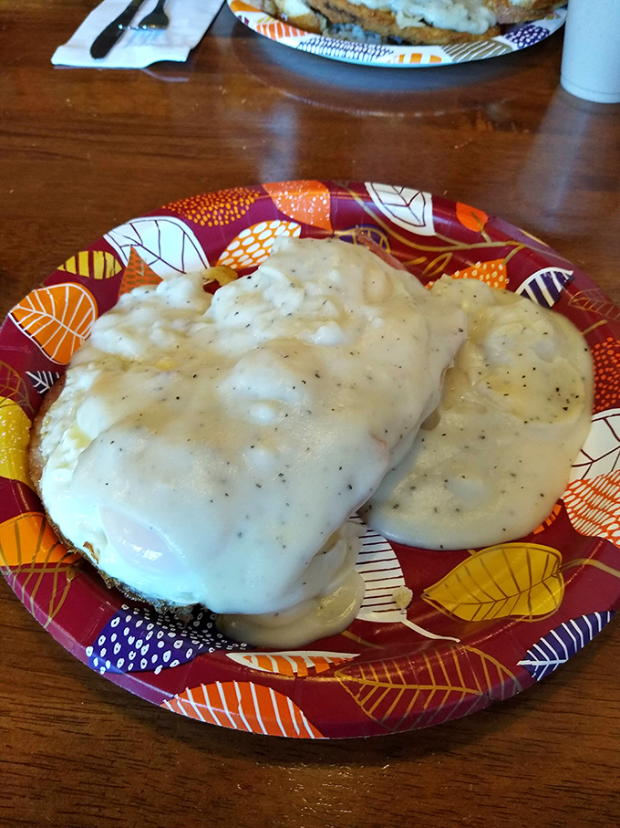 Biscuits and gravy that would make your Southern grandmother nod in approval—creamy, peppery perfection that demands to be savored slowly.
