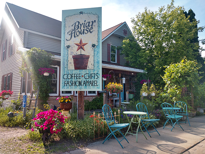 The Briar House offers a splash of color and charm with its inviting porch and garden seating. Coffee, gifts, and small-town hospitality await.