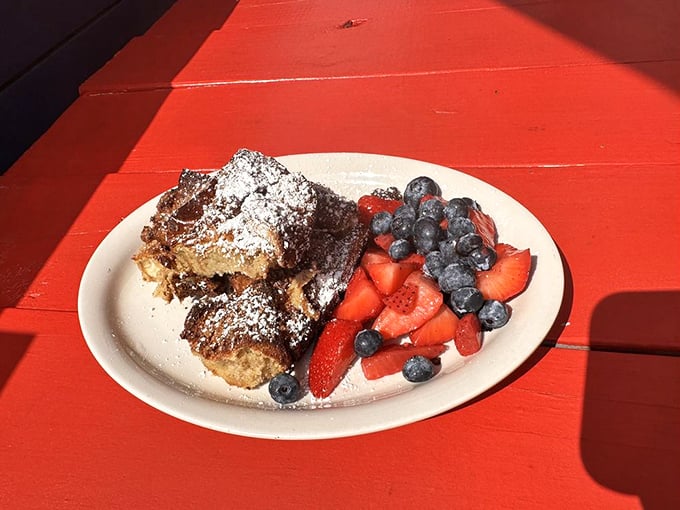 French toast that doesn't need a filter! Dusted with powdered sugar and accompanied by fresh berries, it's breakfast that thinks it's dessert.