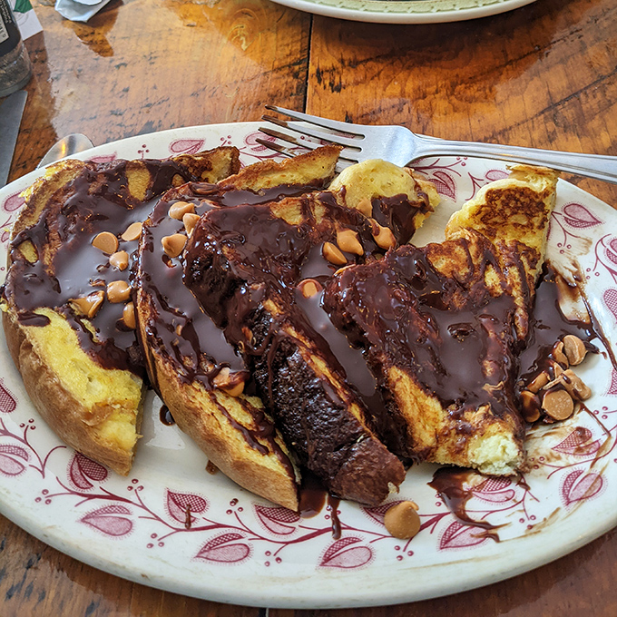 French toast that's had a luxurious spa day. Chocolate drizzle and nuts transform breakfast into an experience worth driving across state lines for.