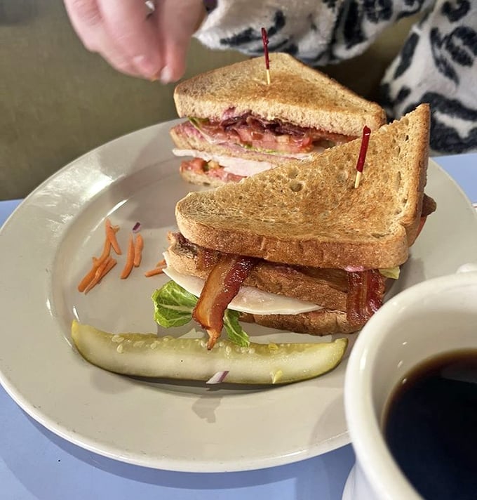 This isn't just a sandwich; it's architecture&mdash;layers of turkey, bacon, and veggies creating the Taj Mahal of club sandwiches.