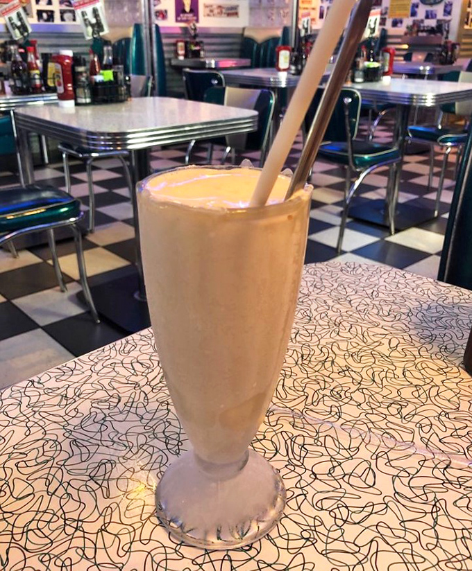 This isn't just a vanilla shake—it's a creamy cloud of happiness in a glass. The straw stands at attention, ready for your sipping pleasure.
