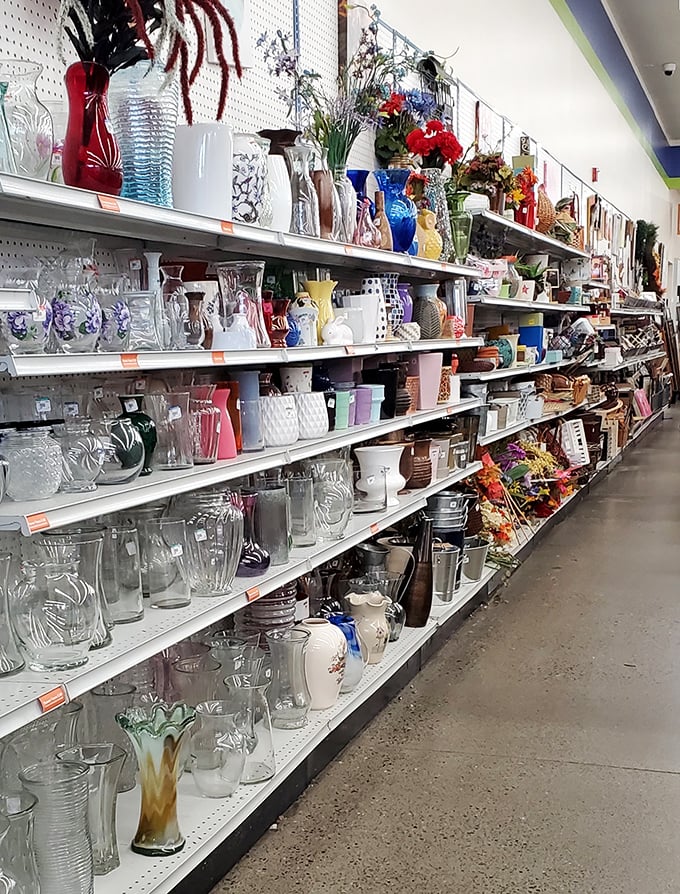 A glass menagerie of possibilities! From mid-century modern vases to quirky decanters, each shelf tells stories of dinner parties past.