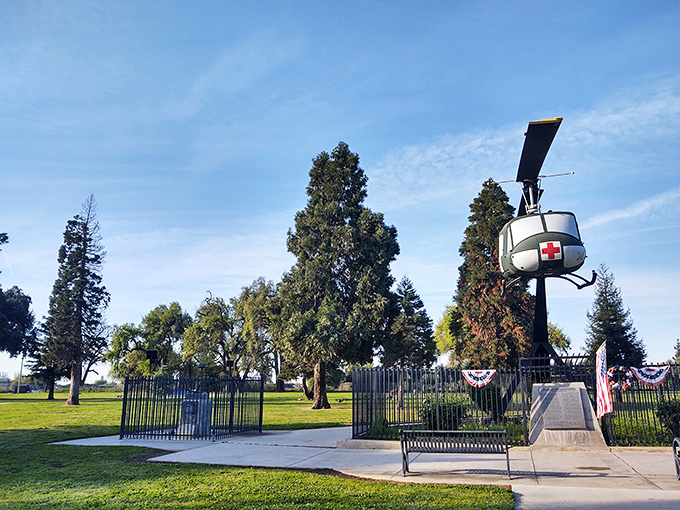 A military helicopter memorial stands proudly in Veterans Park, honoring service while providing a peaceful spot for reflection without admission fees.