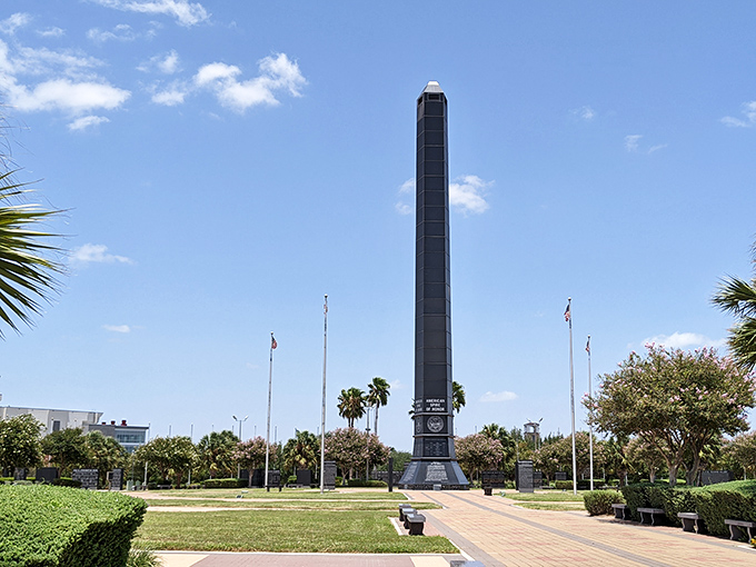 The Veteran's War Memorial stands tall against the South Texas sky, a solemn reminder of sacrifice amid the city's palm-dotted landscape.