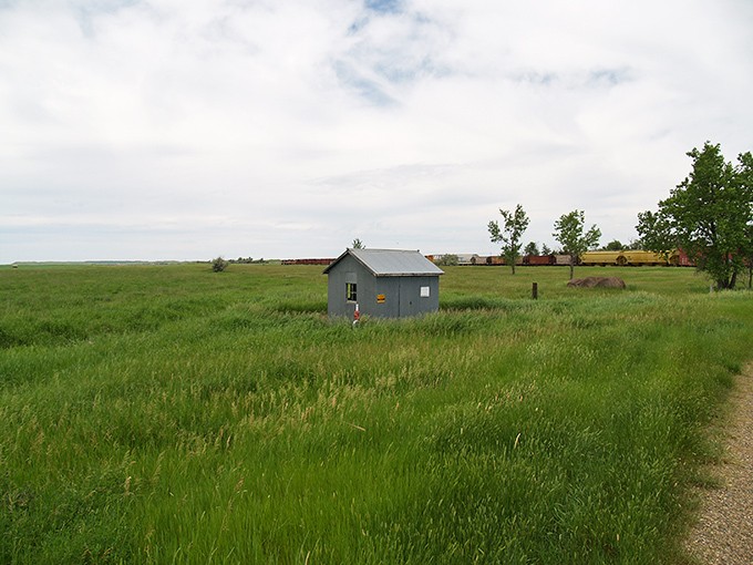 This small utility building, now surrounded by prairie grass, once served a community with big aspirations.