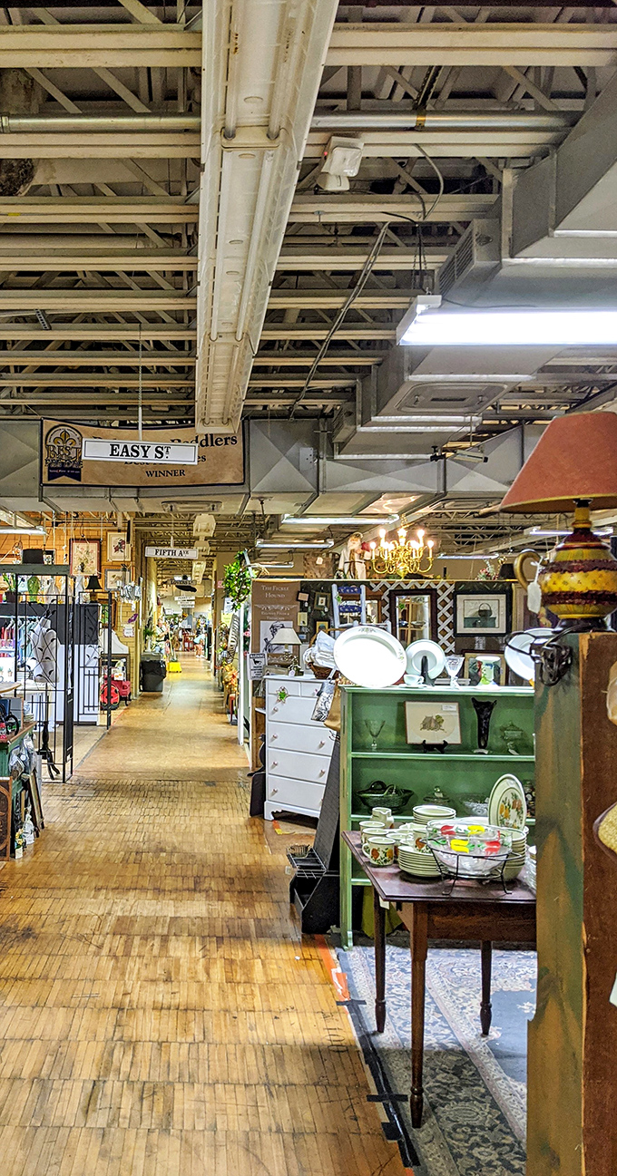 The wooden floors creak like they're whispering secrets about the treasures they've seen. Each booth is its own time capsule waiting to be explored.
