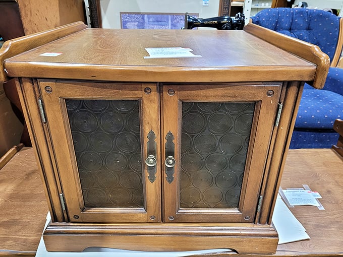 This vintage cabinet isn't just furniture&mdash;it's a time machine with storage space. Don Draper would approve of those glass panels.