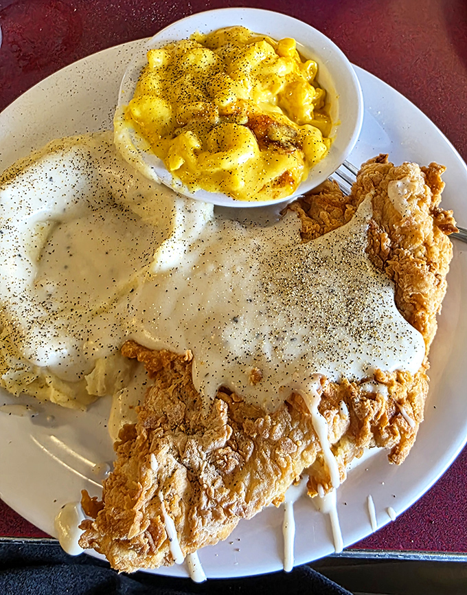 Chicken fried steak with pepper-flecked gravy and mac and cheese &ndash; a plate that says "diet starts tomorrow" in the most delicious way possible.