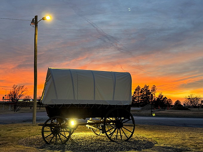 Pioneer spirit lives on in this covered wagon display, dramatically lit against a prairie sunset. History doesn't just survive in Edgeley&mdash;it glows.