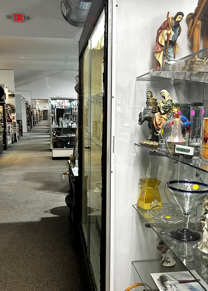 Religious figurines and glassware line the corridor like sentinels guarding pathways to the past. The journey through time continues.