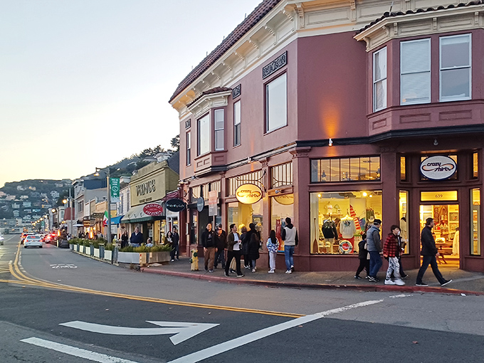 As evening falls, Sausalito's main drag transforms into a promenade of possibilities, where dinner decisions become delightfully difficult.