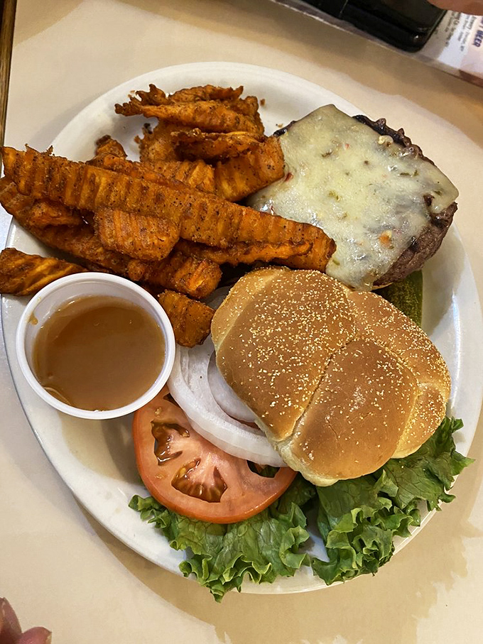 Sweet potato fries that could make a grown rancher weep with joy, paired with a burger that's clearly not just phoning it in.