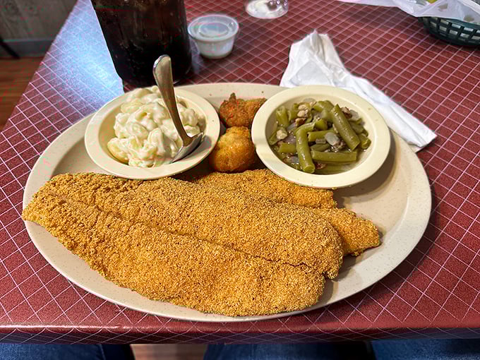Golden-crusted catfish that crunches like the soundtrack to happiness, paired with sides that know their supporting role perfectly.
