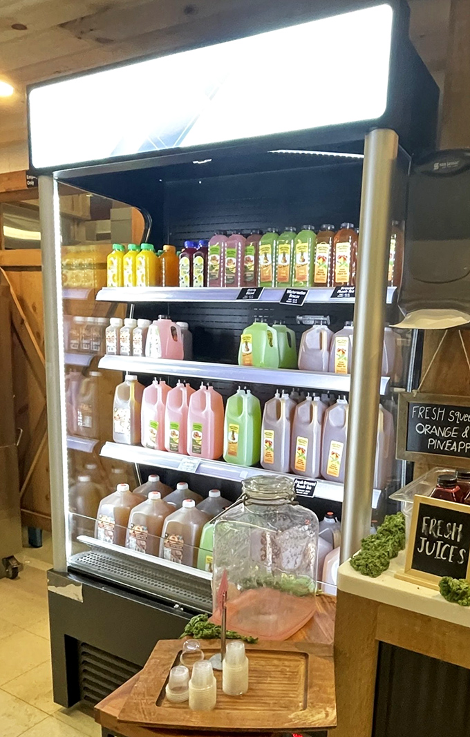 A rainbow of fresh-pressed juices lines the cooler like liquid sunshine in bottles, each promising a sip of farm-fresh vitality.
