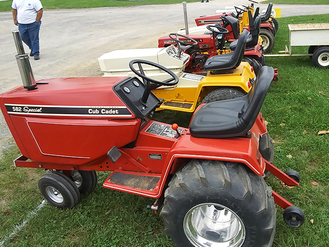 Lawn care with vintage flair! These meticulously maintained Cub Cadet garden tractors remind us when mowing was an event, not just a chore.