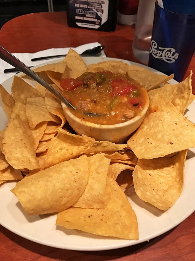 These nachos aren't just a snack, they're an architectural achievement &ndash; a crunchy, cheesy monument to the art of proper chip-to-dip ratio engineering.