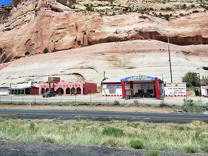 Where roadside charm meets dramatic geology &ndash; these colorful shops against red rock cliffs embody the quintessential Southwest experience.