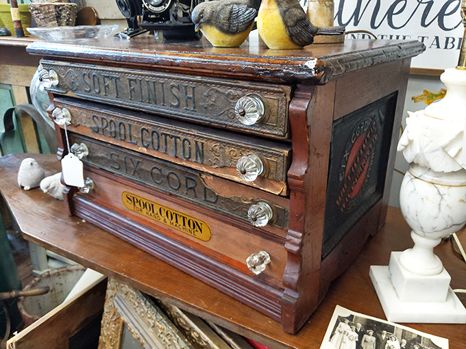 A vintage spool cabinet that once organized a seamstress's threads now waits to organize your treasures. Craftsmanship that's outlived its maker.