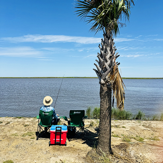 The patient angler's paradise: one person, one chair, one cooler, and endless possibilities swimming beneath that glassy surface.