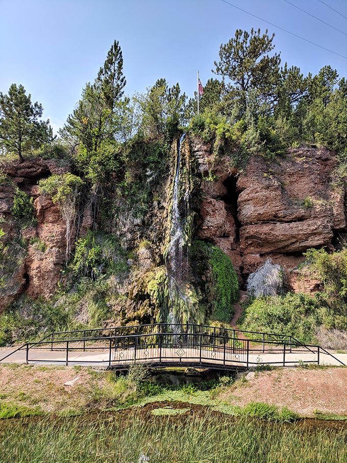 Nature's own spa treatment cascades down red rock cliffs. This waterfall doesn't need a fancy Instagram filter—it's been perfecting its look for millennia.