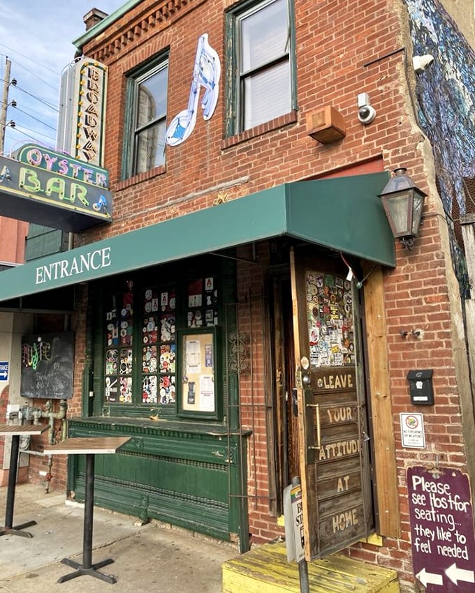 Broadway Oyster Bar's character-filled entrance, where every sticker tells a story of good times and great food.