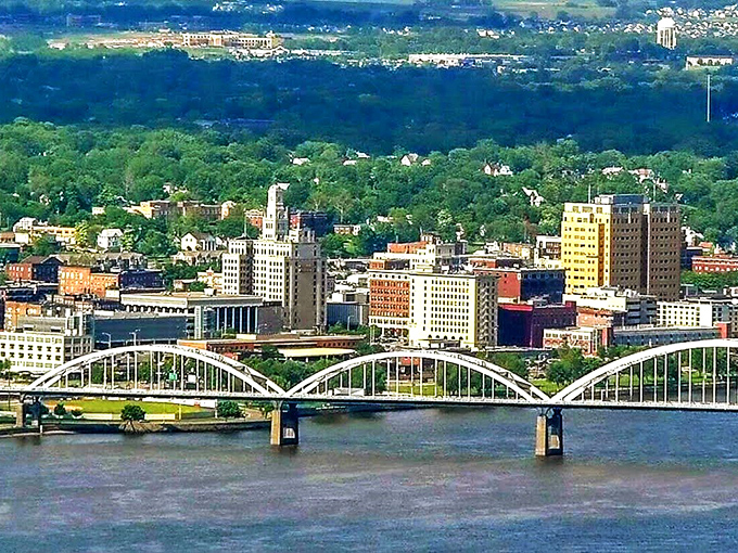 The Mississippi River frames Davenport's skyline where historic bridges connect communities and modern life meets timeless river town character.