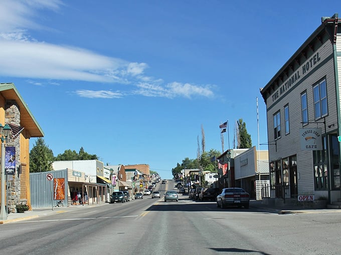 The historic National Hotel anchors this sunlit main street, where western architecture tells stories of Montana's past.