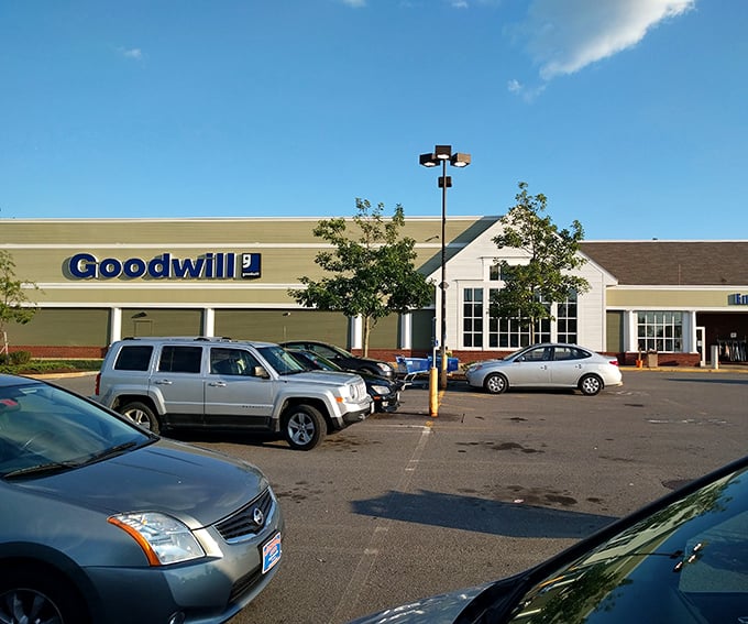 Goodwill's spacious parking lot hints at the vastness of bargains inside. Your grandmother was right—thrift shopping IS an Olympic sport.