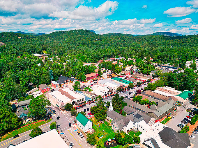 Highlands, North Carolina from above - a charming mountain town nestled among lush green forests with quaint buildings and winding streets.