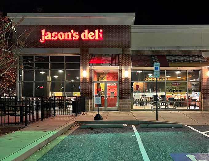 Jason's Deli's glowing sign cuts through the night like a lighthouse for the hungry. The promise of fresh salads and sandwiches just steps away.
