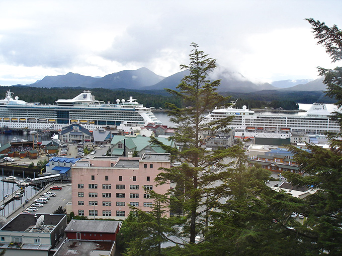 Ketchikan's colorful waterfront buildings climb the hillside like a rainbow decided to settle down, with cruise ships adding to the bustling harbor scene.