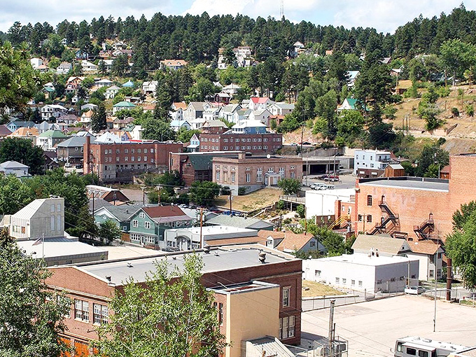 Lead's hillside homes cascade down like a colorful waterfall, nestled among pines that whisper tales of gold rush dreams.