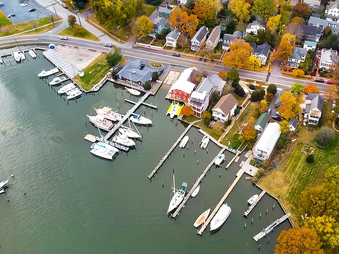 Oxford's marina at sunset &ndash; where boats rest peacefully and autumn trees paint the shoreline in fiery hues of gold and crimson.