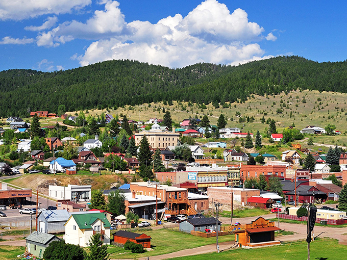 A colorful patchwork of historic buildings nestled against Montana's mountains, where every rooftop tells a story.