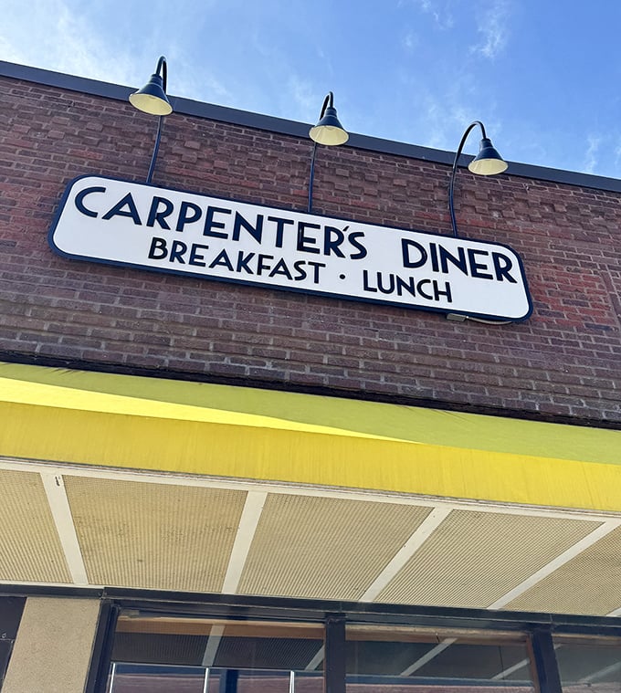 Three vintage lamps illuminate Carpenter's classic sign &ndash; a timeless promise of breakfast done right in downtown Waterloo.