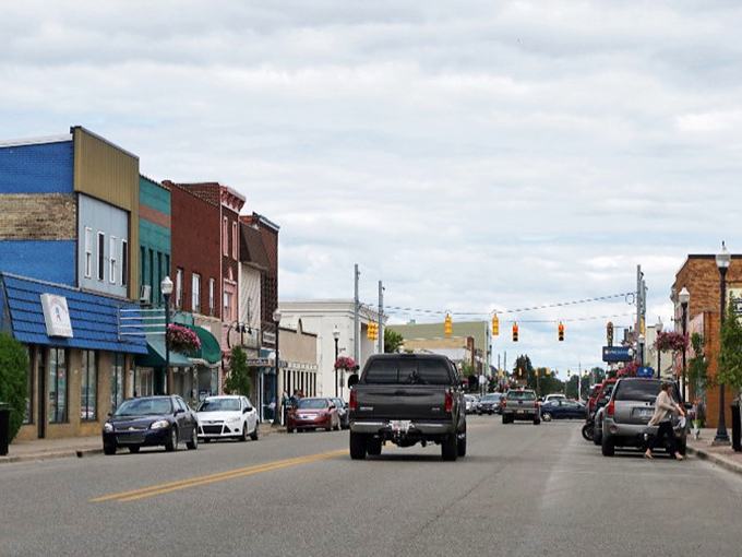Cheboygan's main drag: where your Social Security check goes further than these cars. Small-town prices with big-town character.