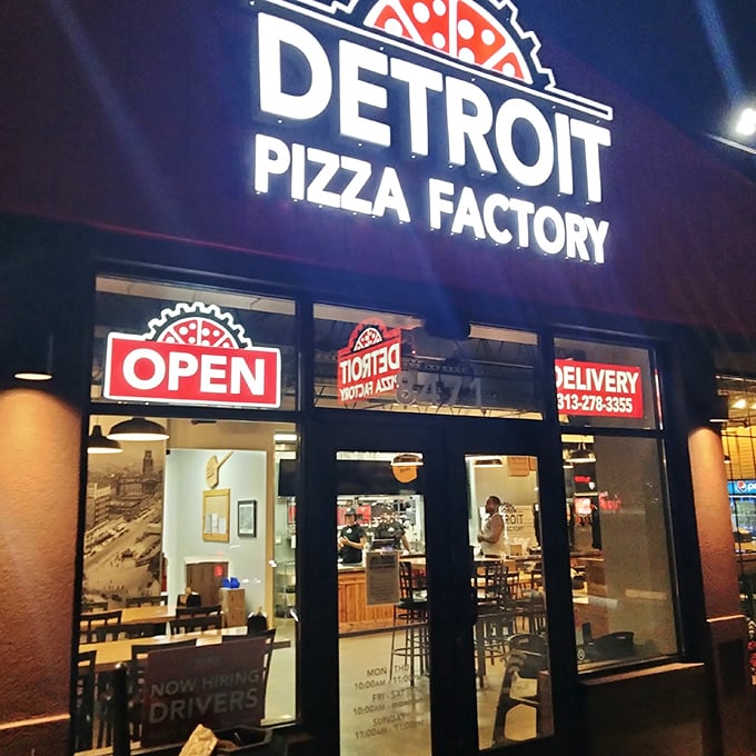 When the "OPEN" sign glows at Detroit Pizza Factory, it's like a bat signal for serious pizza lovers.